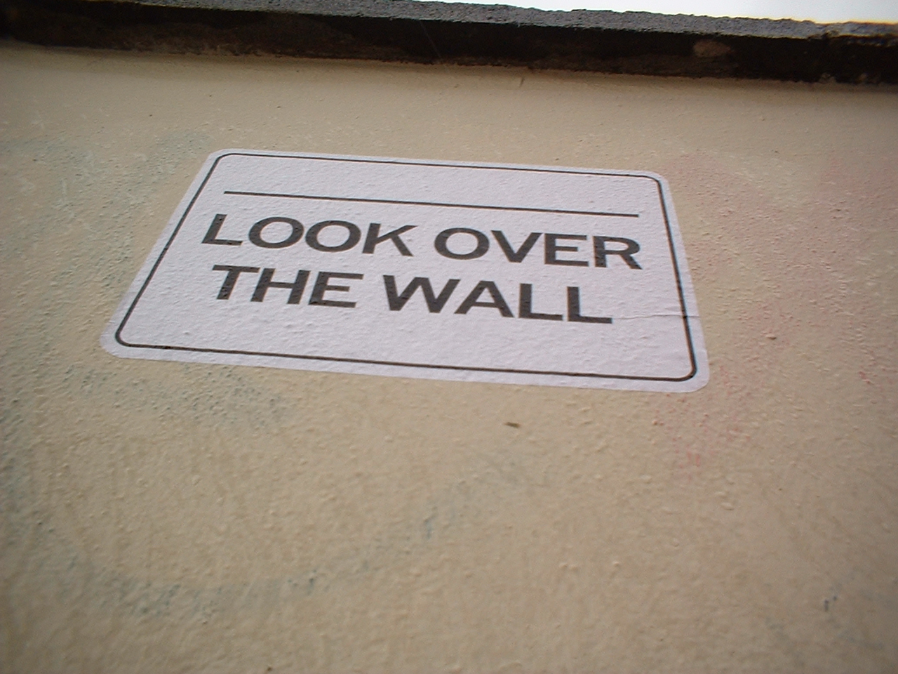 Fly poster graffiti street art, Look over the wall, Bristol, United ...