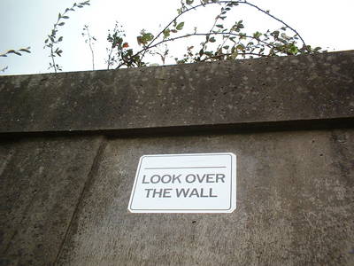 Fly poster graffiti street art, Look over the wall, Bristol, United ...